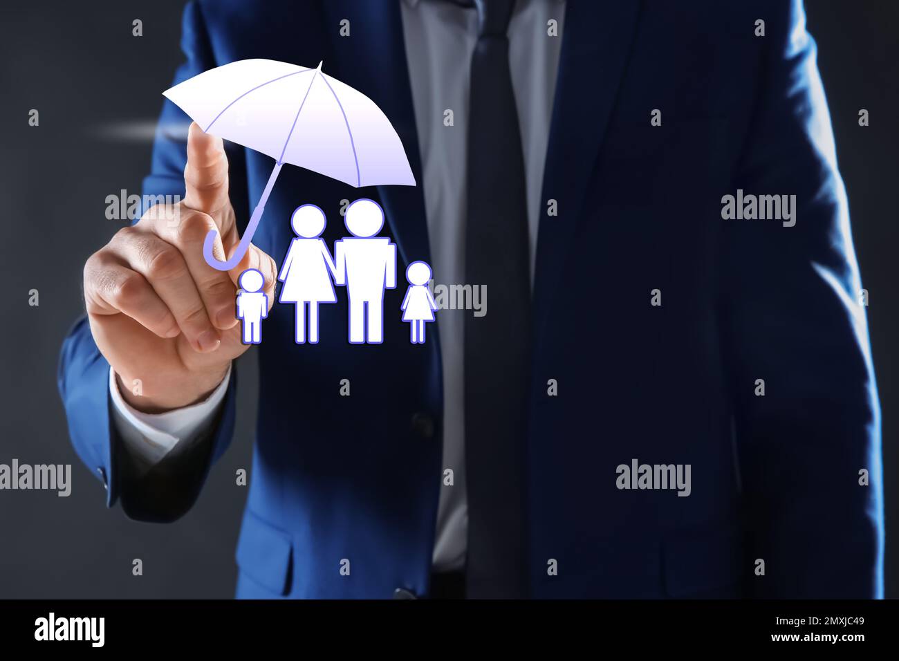 Insurance concept - umbrella demonstrating protection. Man using ...