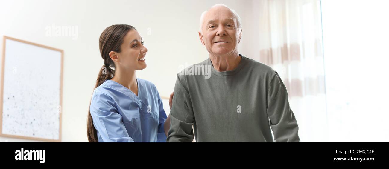 Care worker helping elderly man in geriatric hospice. Banner design ...