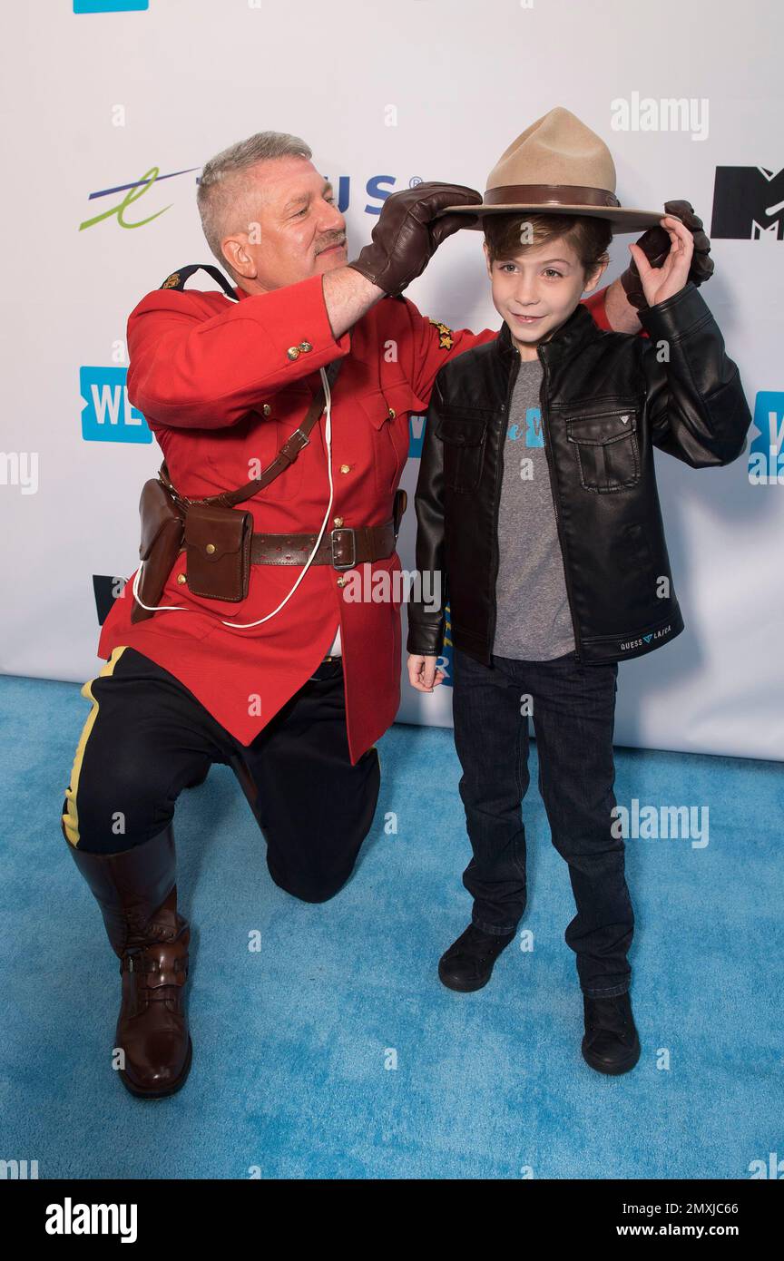 RCMP Constable Terry Russel, left, and Jacob Tremblay arrive at WE Day ...