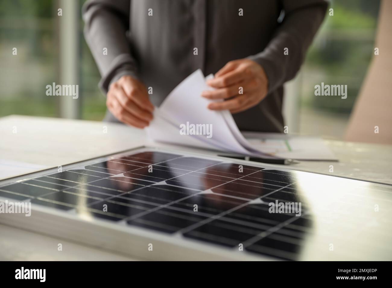 Woman papers solar panel hi-res stock photography and images - Alamy