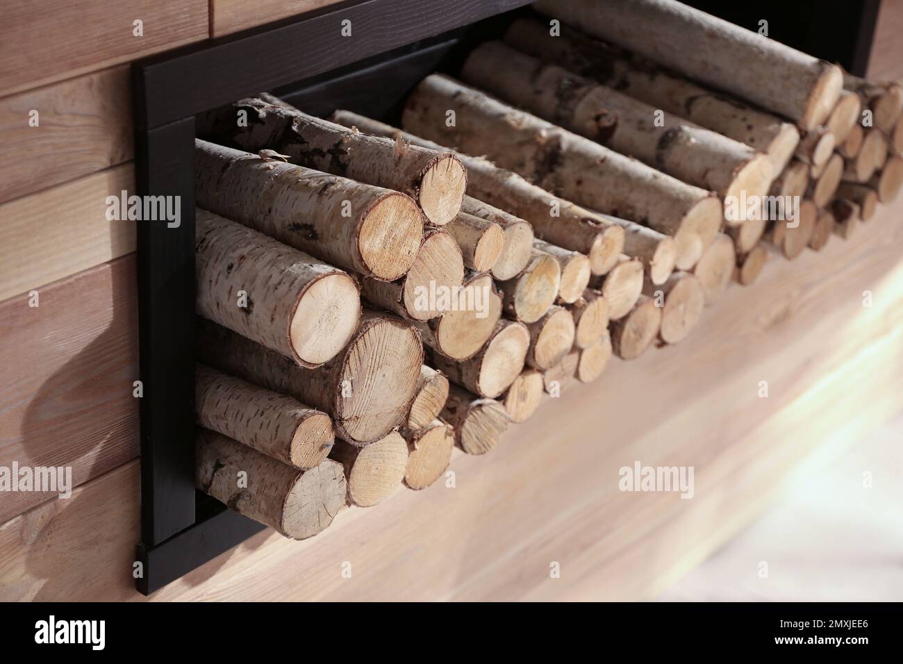 Decorative fireplace with stacked wood indoors. Idea for interior ...