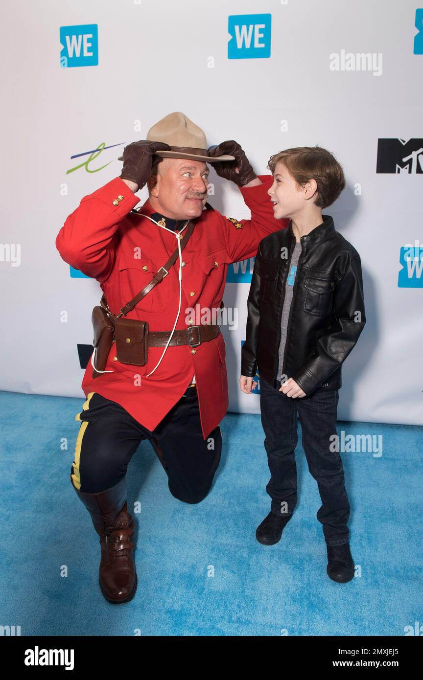 RCMP Constable Terry Russel, left, and Jacob Tremblay arrive at WE Day ...