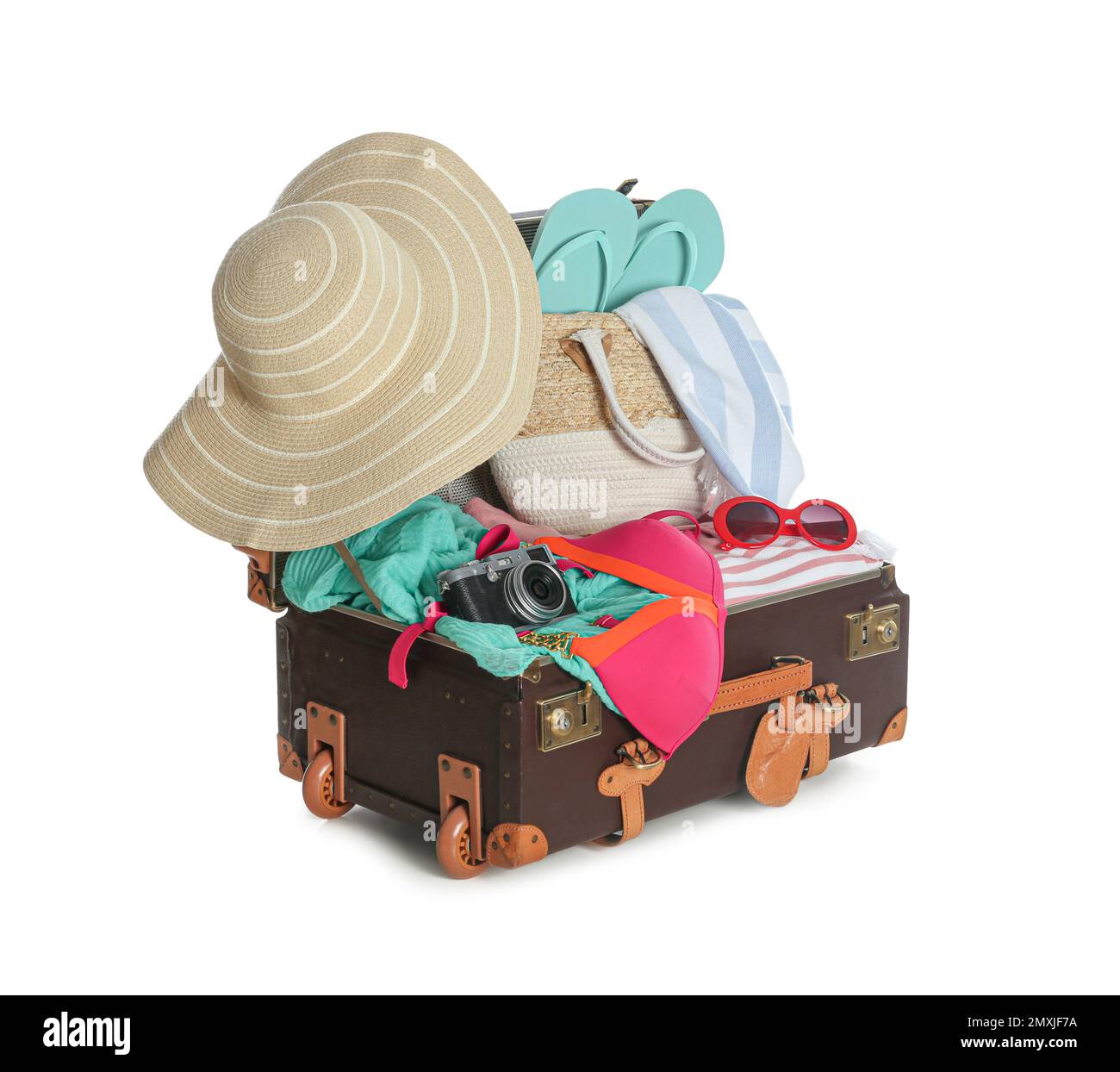 Open vintage suitcase with different beach objects packed for summer ...