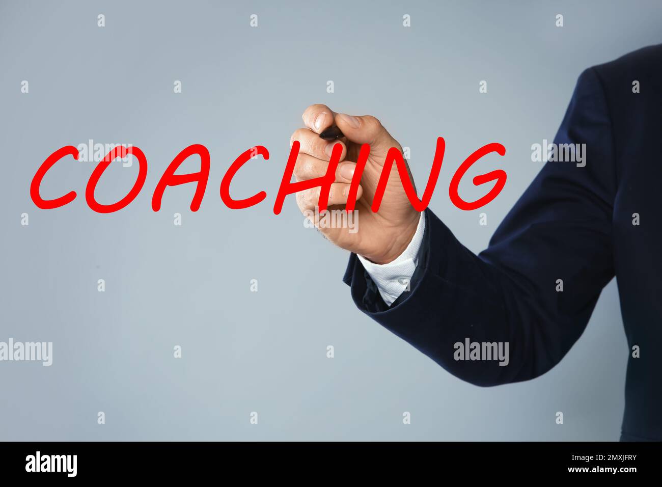 Business trainer writing word Coaching on virtual screen, closeup Stock ...