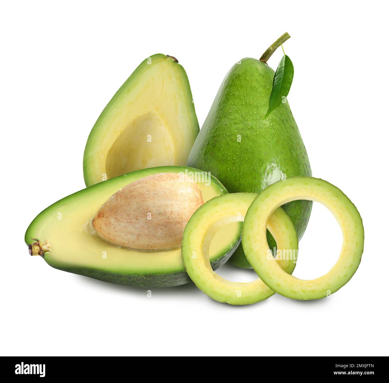 Cut and whole fresh avocados on white background Stock Photo - Alamy