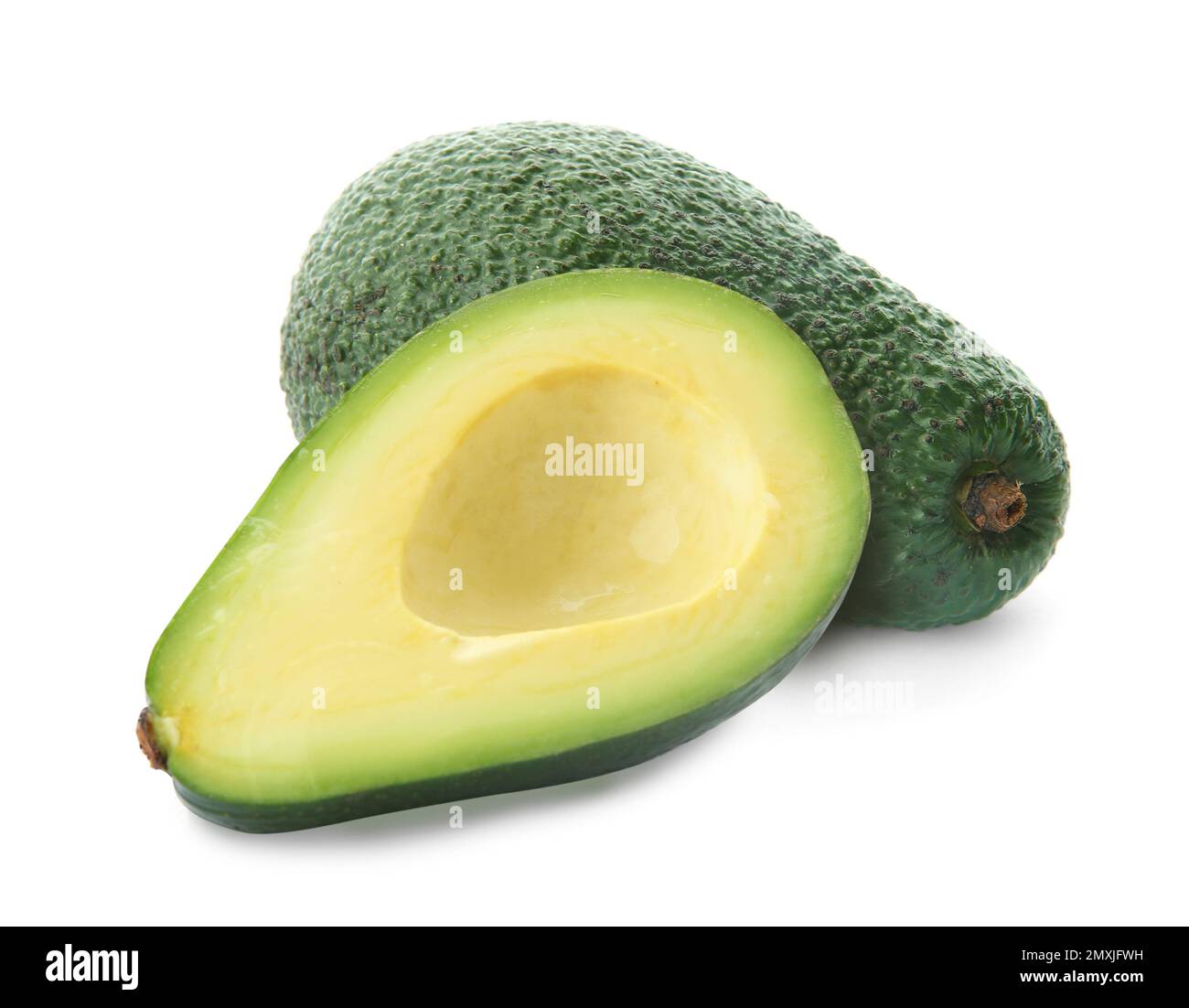 Cut and whole fresh avocados on white background Stock Photo - Alamy