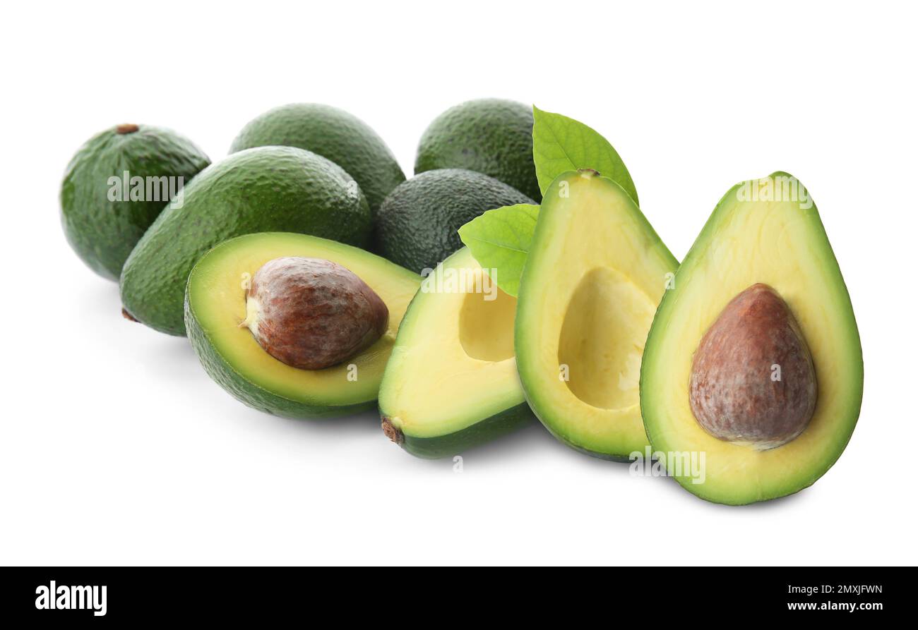 Cut and whole fresh avocados on white background Stock Photo - Alamy