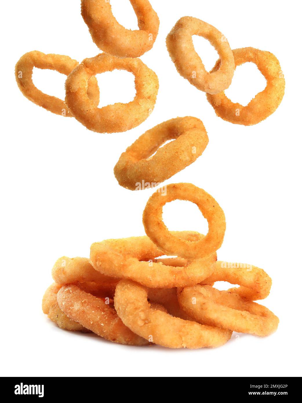Fried onion rings falling on white background Stock Photo - Alamy