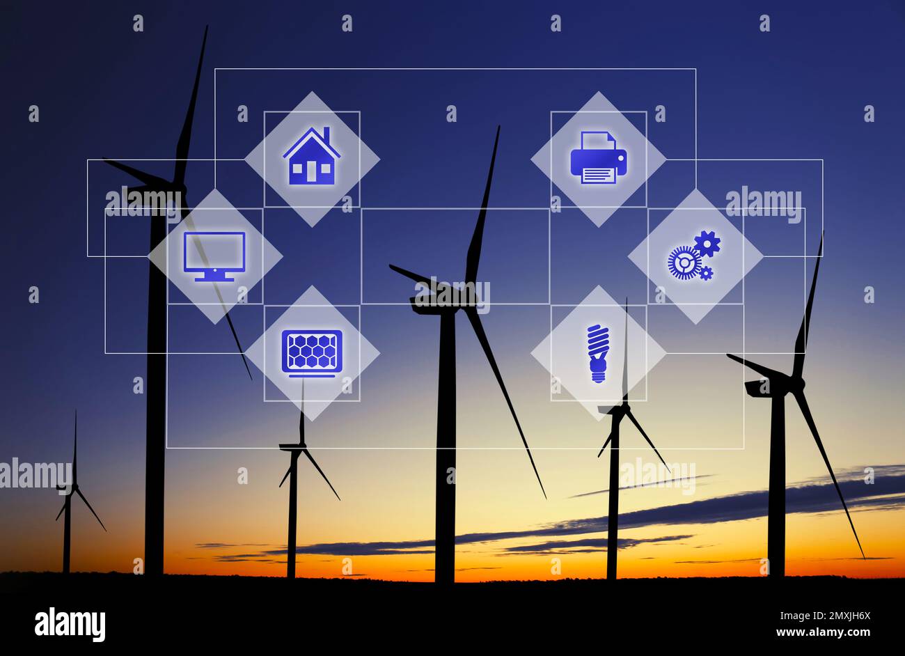 Alternative energy source. Silhouettes of wind turbines at sunset and ...
