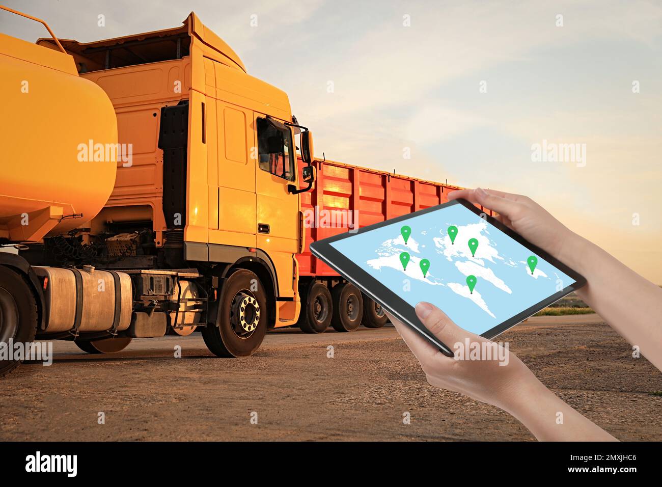 Logistics concept. Woman using tablet with world map on screen against ...