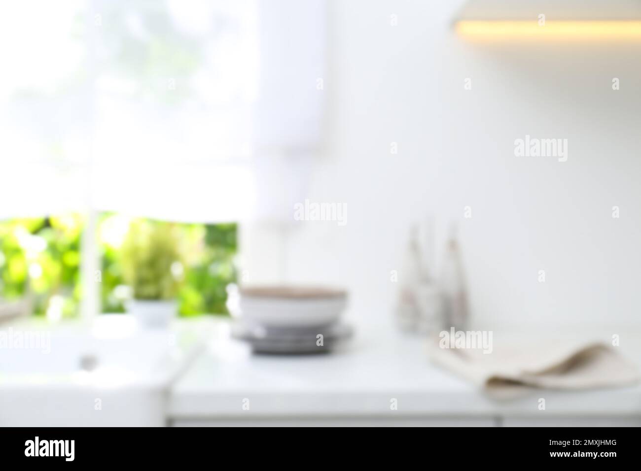 Blurred view of modern kitchen with window Stock Photo - Alamy