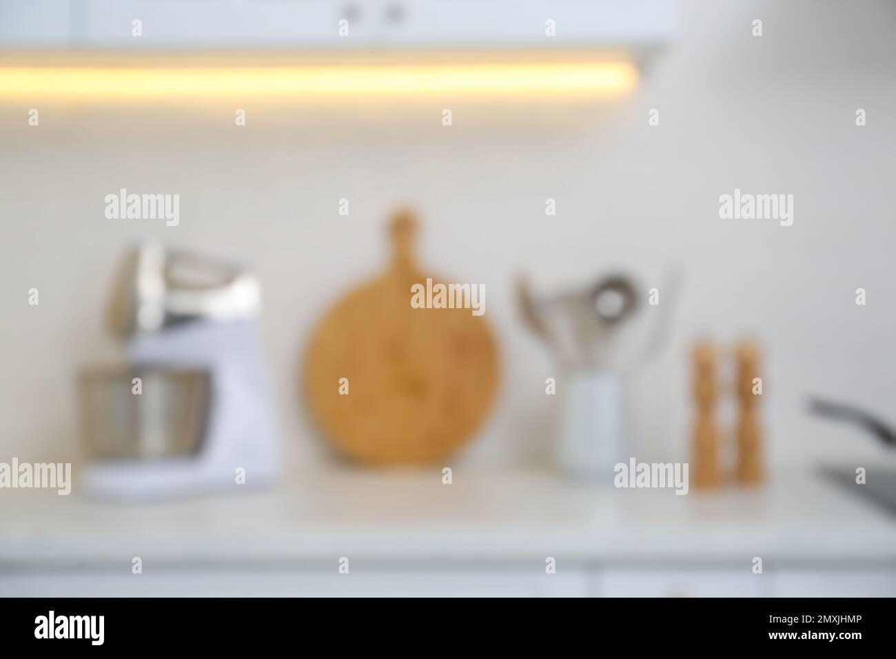 Blurred view of modern kitchen with utensils Stock Photo - Alamy