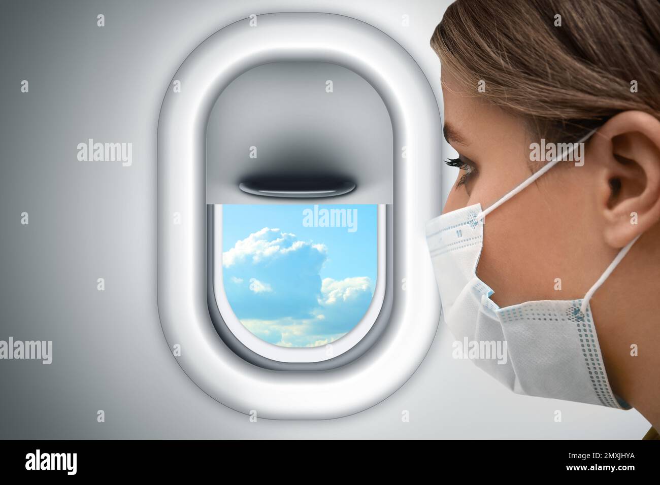 Traveling by airplane during coronavirus pandemic. Woman with face mask ...