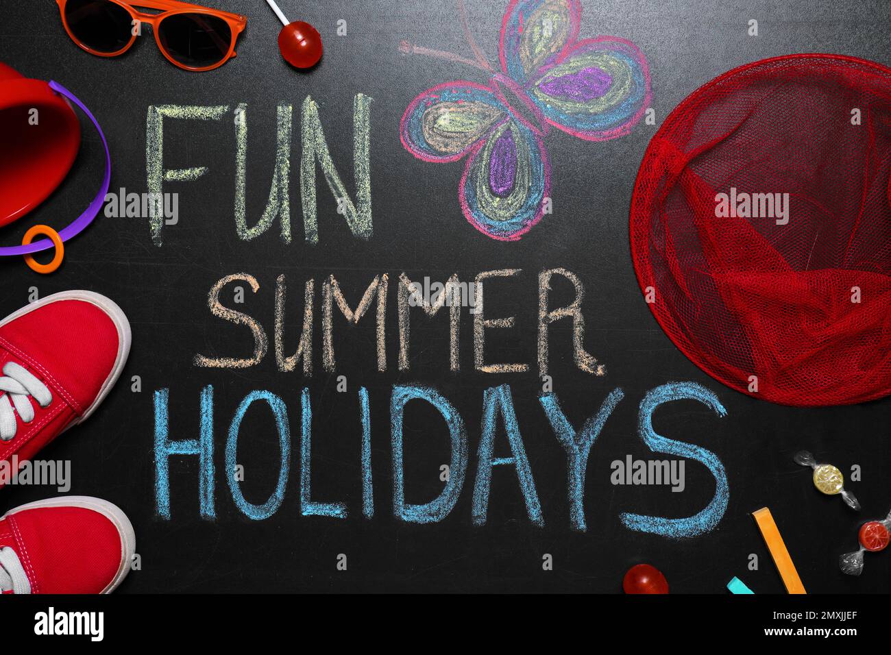 Flat lay composition with child's shoes and inscription Fun Summer ...