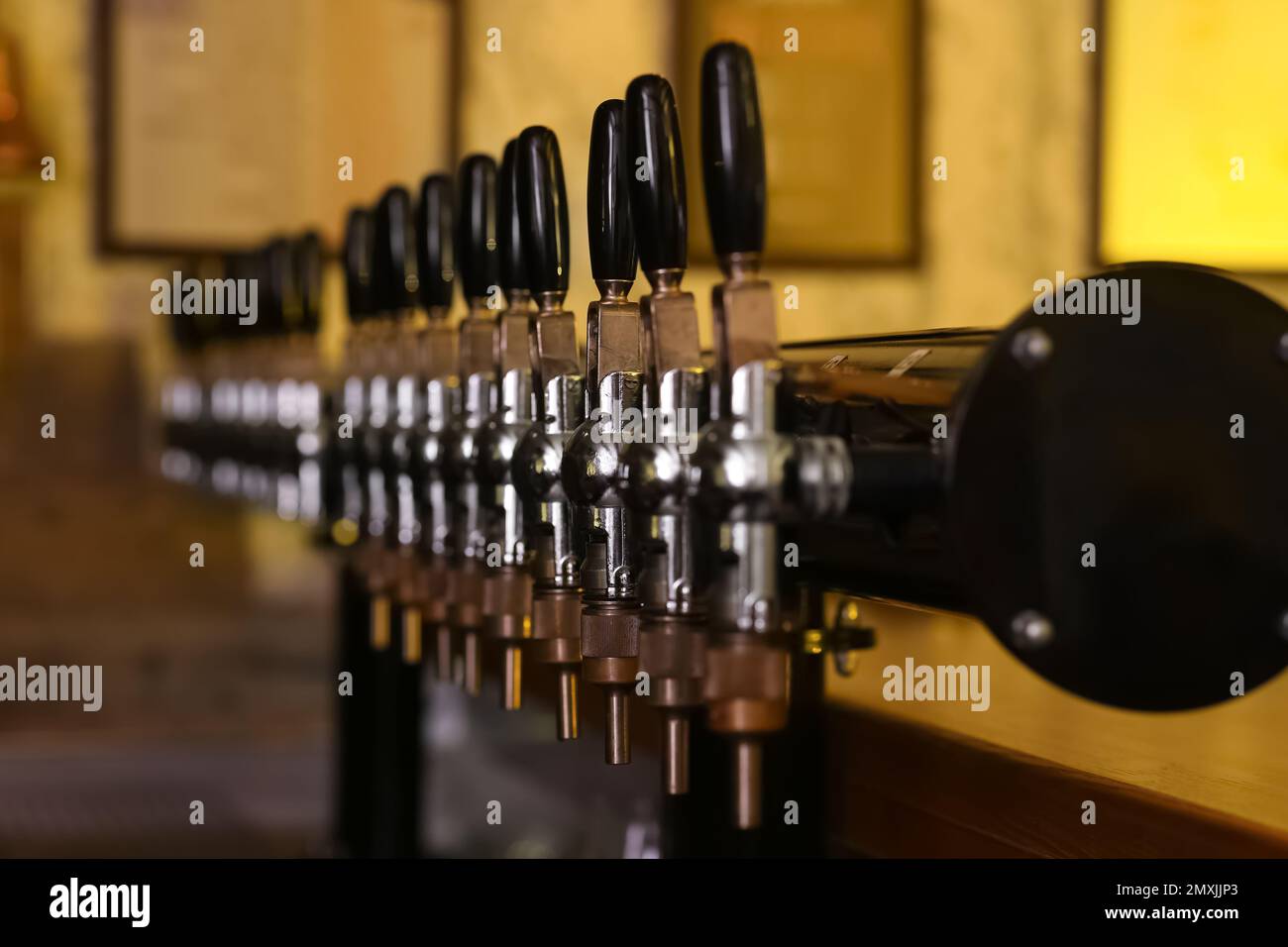 New modern beer taps in pub, closeup. Professional bar equipment Stock ...