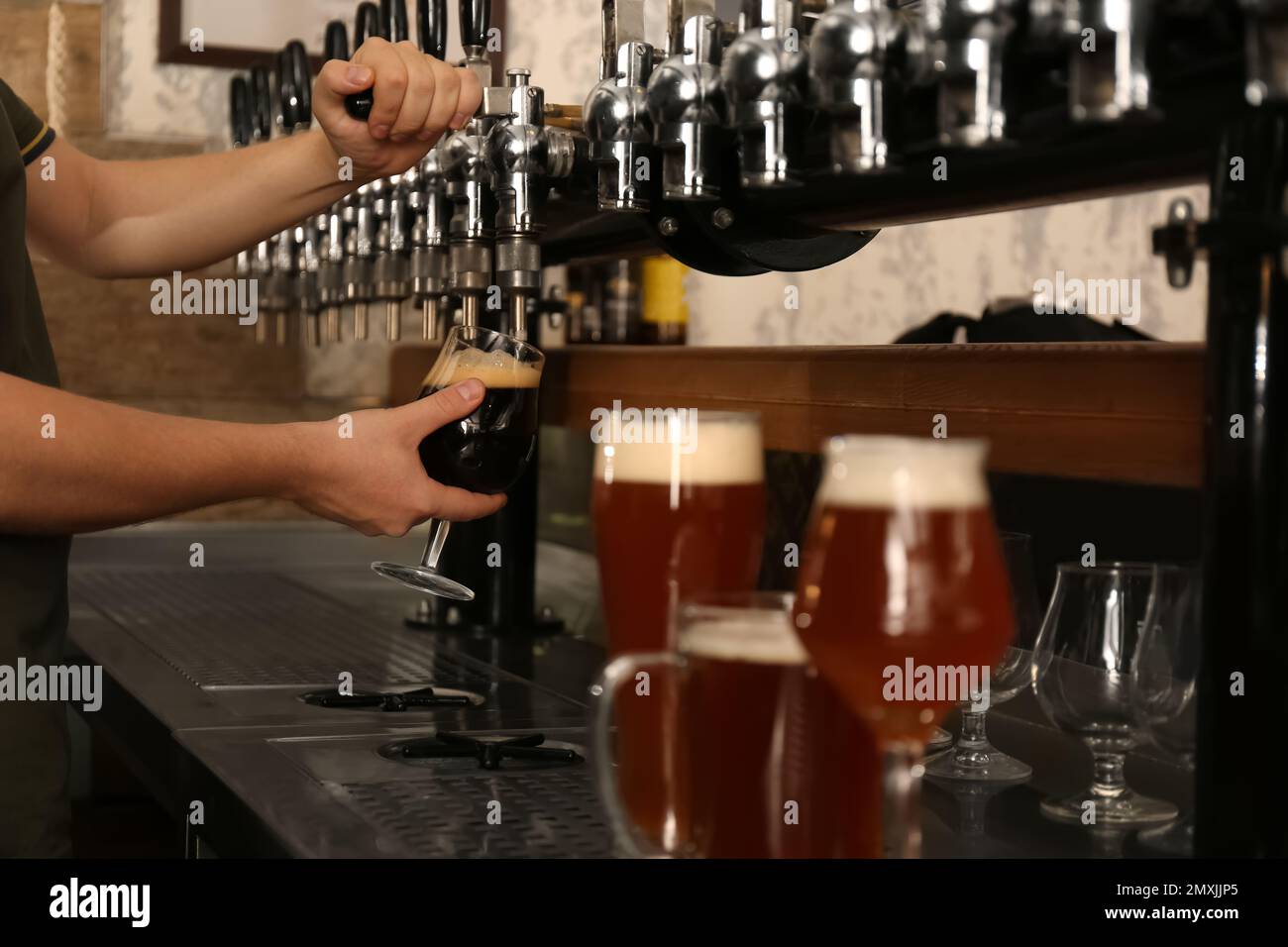 Pouring fresh tasty dark beer hi-res stock photography and images - Alamy