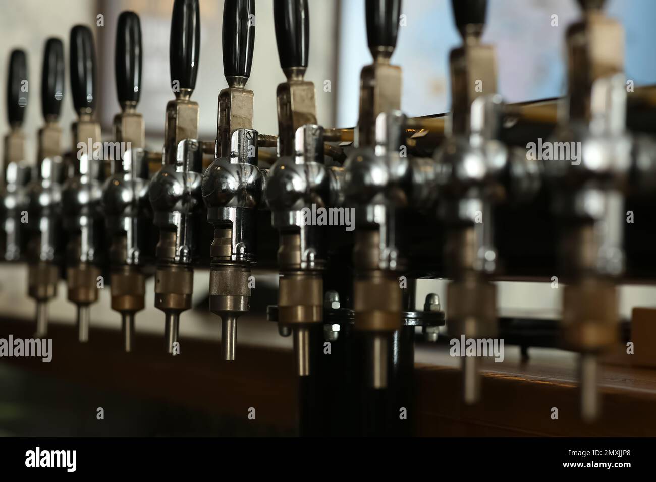 New modern beer taps in pub, closeup. Professional bar equipment Stock ...