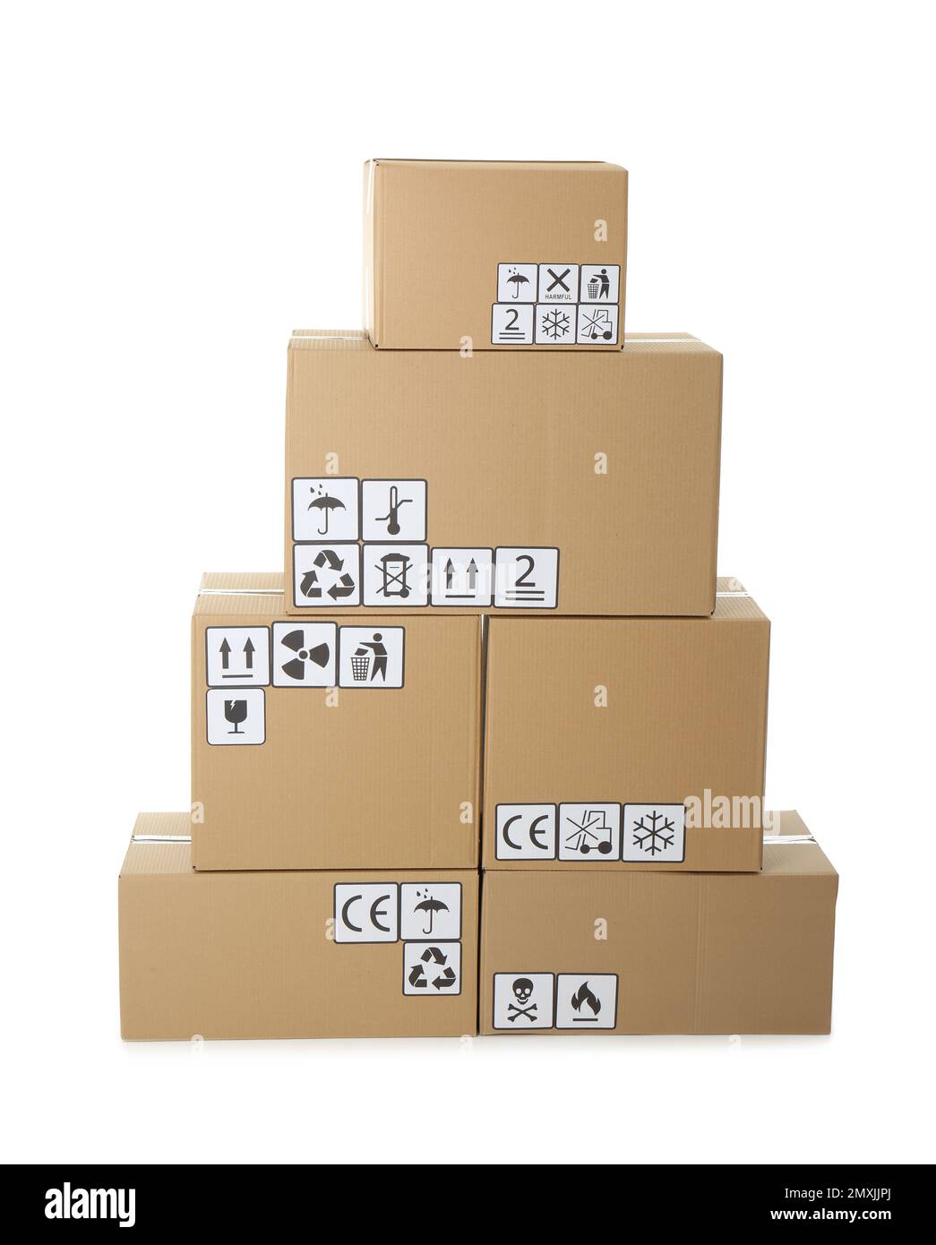 Stack of cardboard boxes with different packaging symbols on white ...