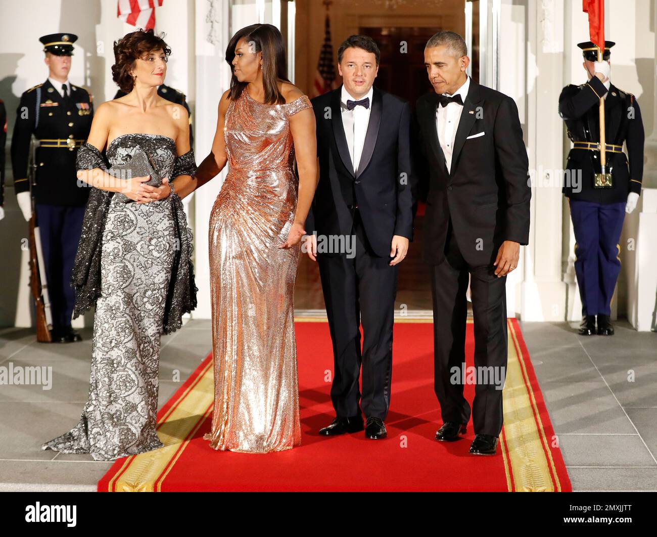 President Barack Obama and first lady Michelle Obama pose for a photo ...
