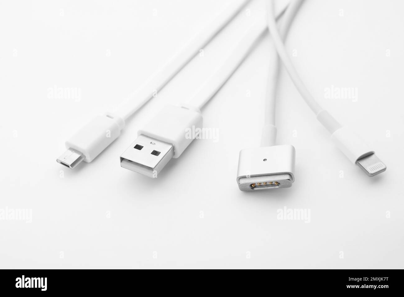 Charge cables on white background. Modern technology Stock Photo - Alamy