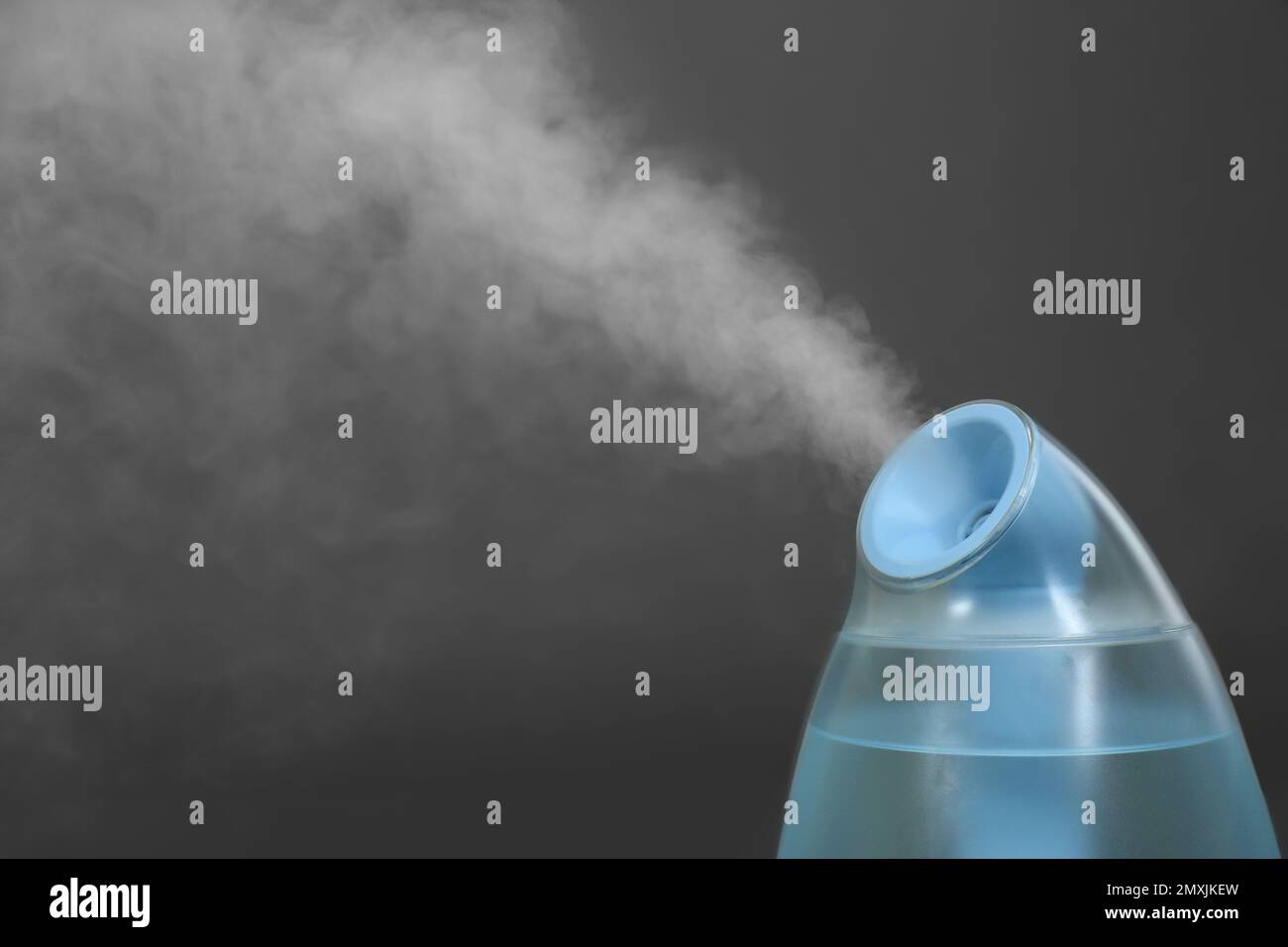 Modern air humidifier on grey background, closeup. Space for text Stock ...