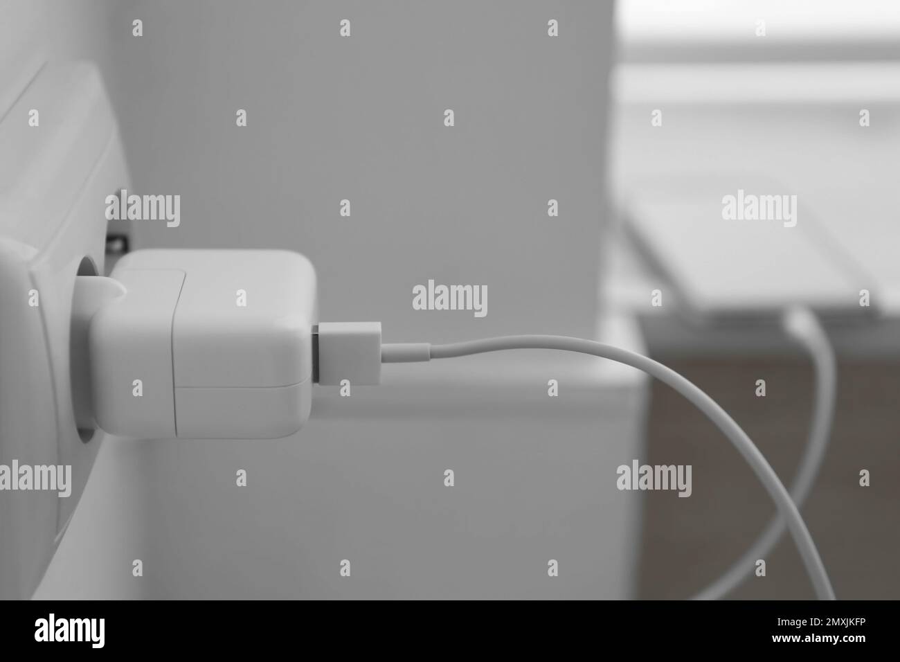 Modern smartphone charging from electric socket, closeup Stock Photo ...