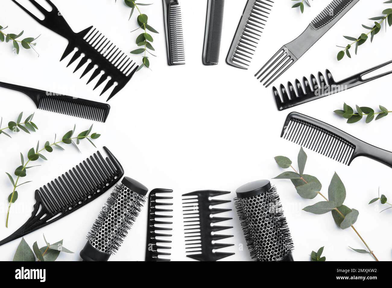 Frame of hair combs and brushes on white background, top view. Space ...
