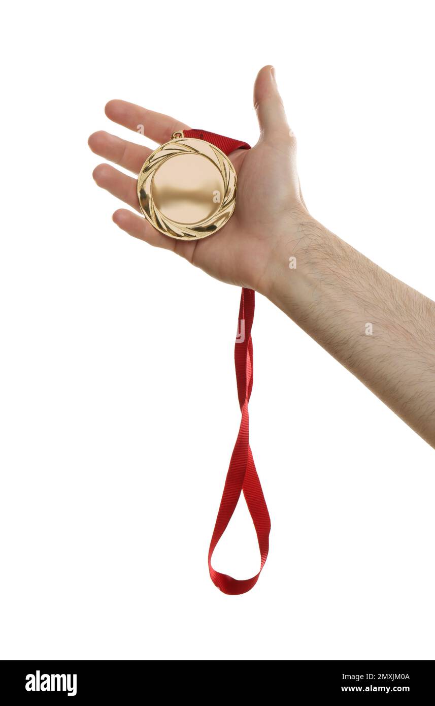 Man holding golden medal on white background, closeup. Space for design ...