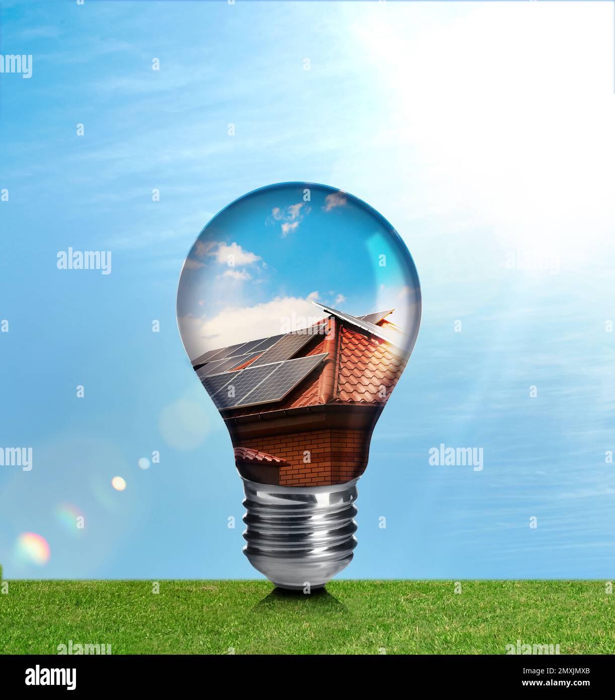 Alternative energy source. Light bulb with solar panels outdoors Stock ...