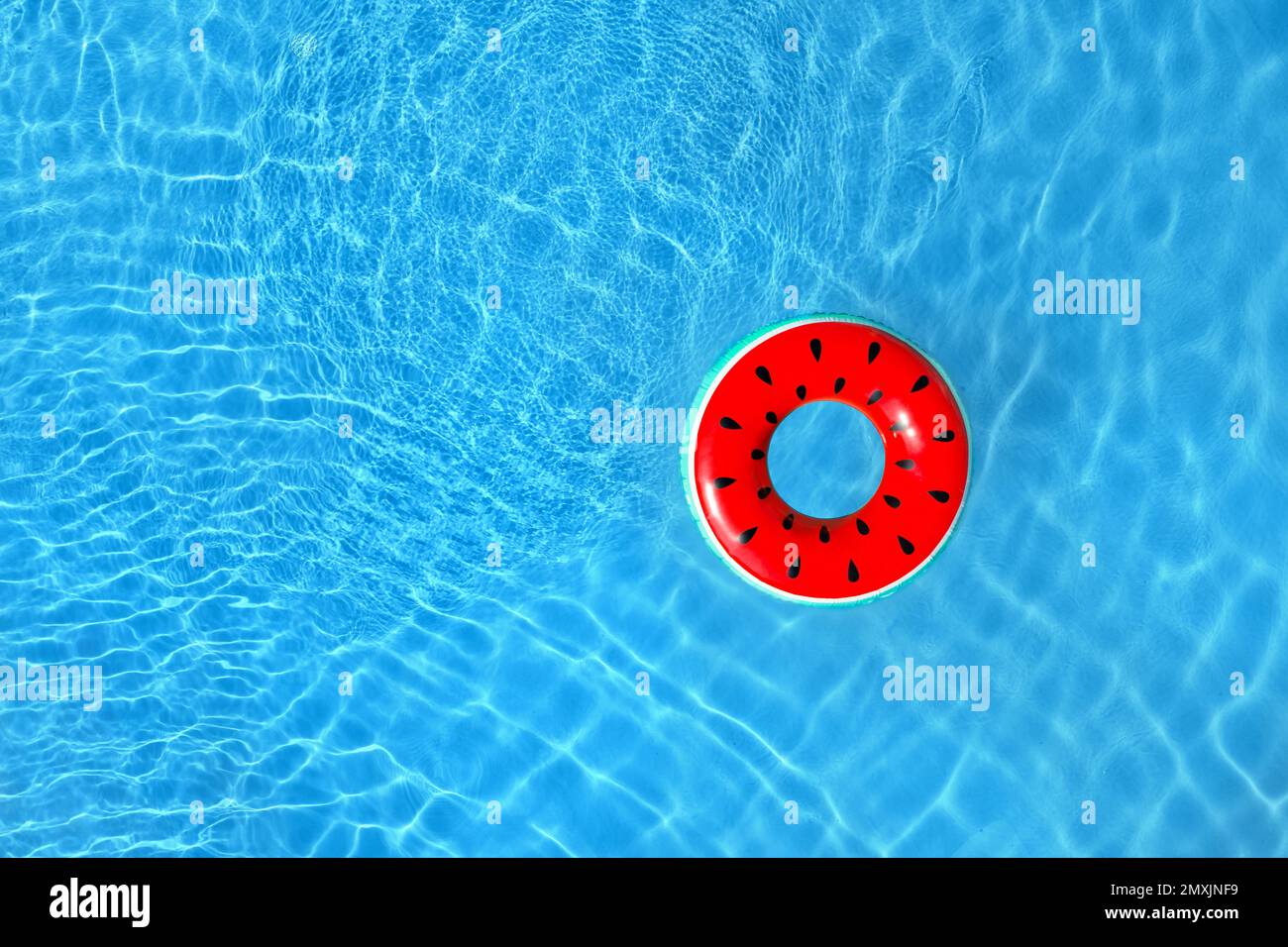 Swimming pool with inflatable ring, top view Stock Photo - Alamy