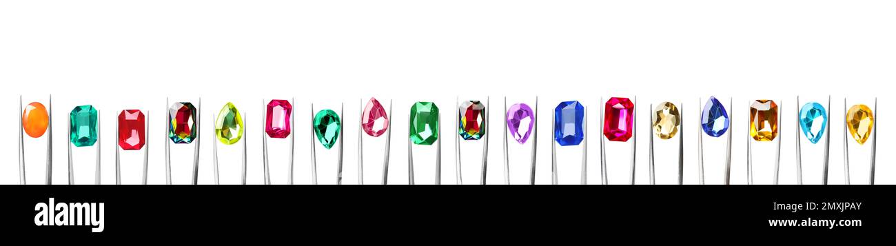 Set of tweezers with different shiny gemstones on white background ...