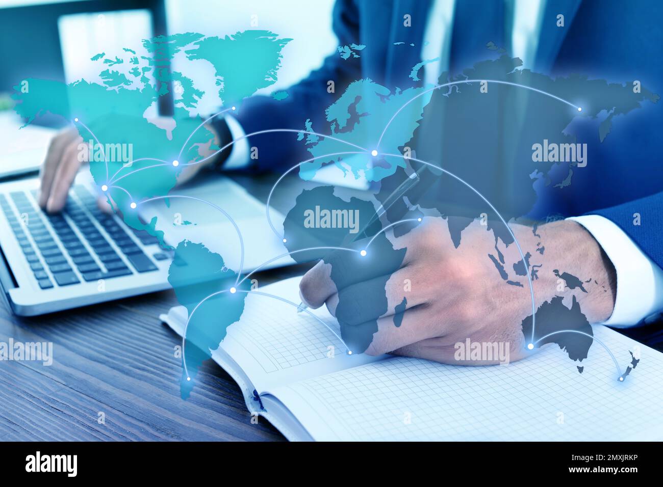 Wholesale and logistics concept. Man using laptop in office, world map ...