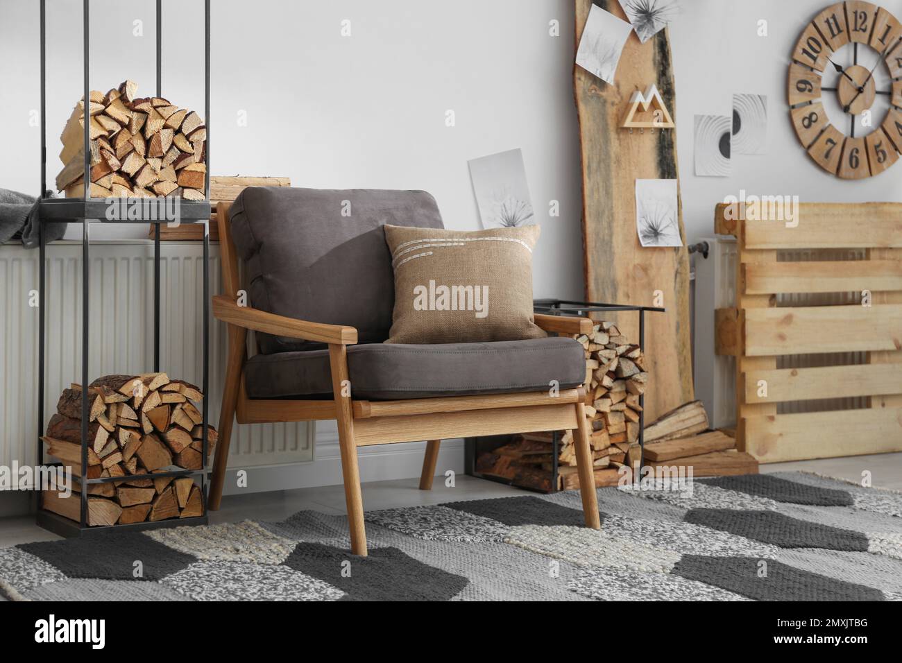 Stylish room interior with firewood as decorative element Stock Photo ...