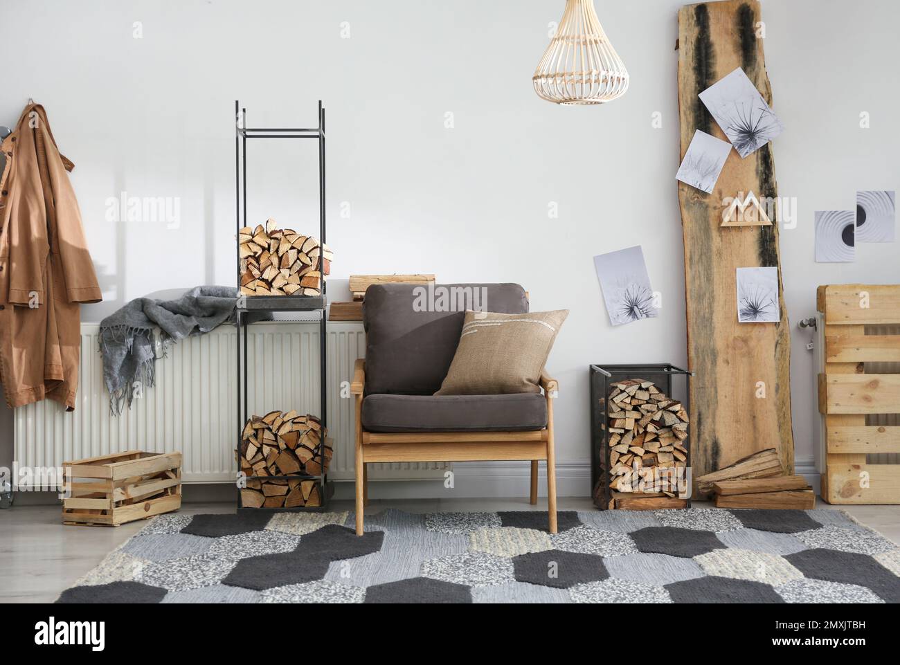 Stylish room interior with firewood as decorative element Stock Photo ...