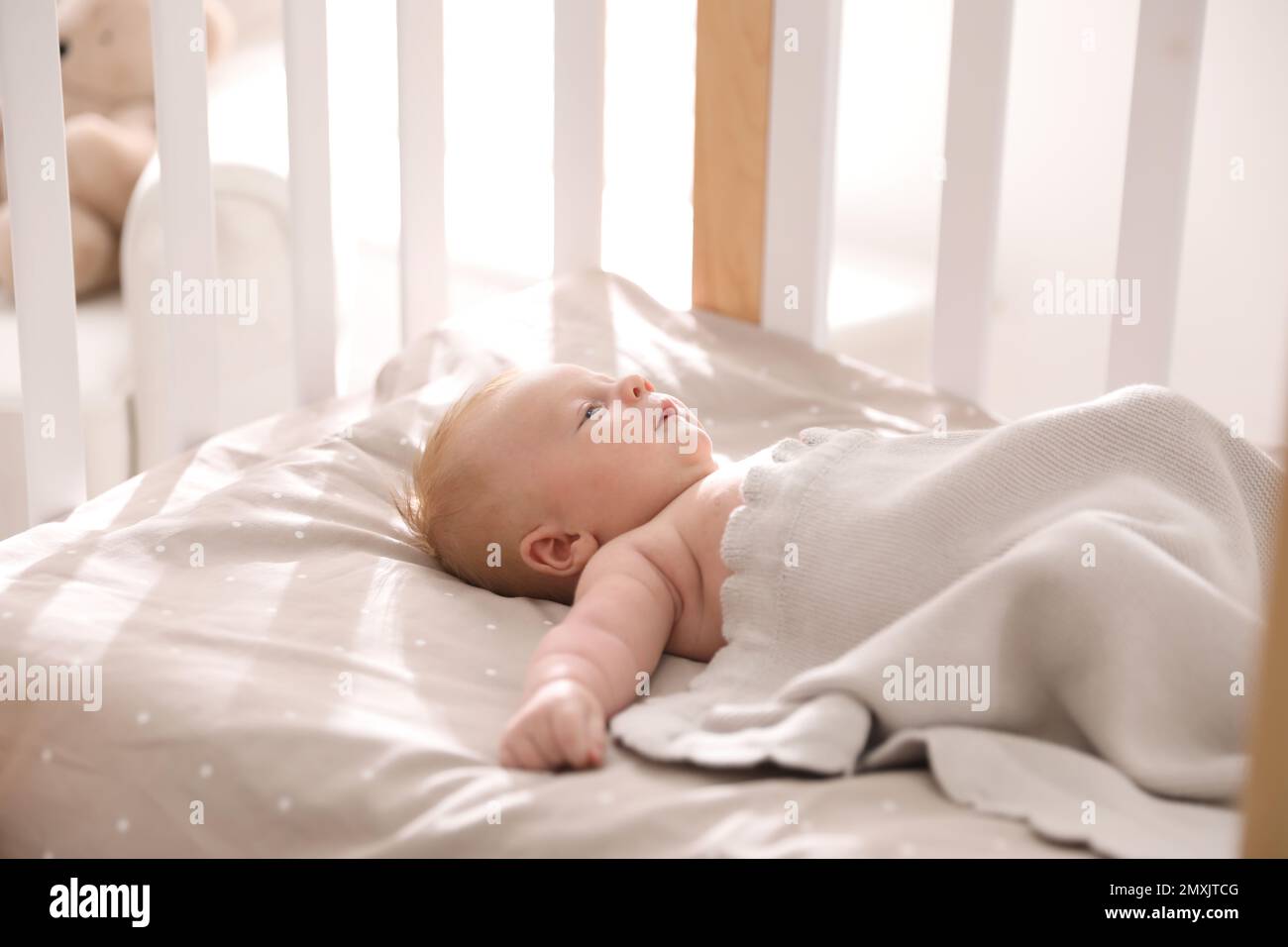Cute little child lying in cot. Healthy baby Stock Photo - Alamy