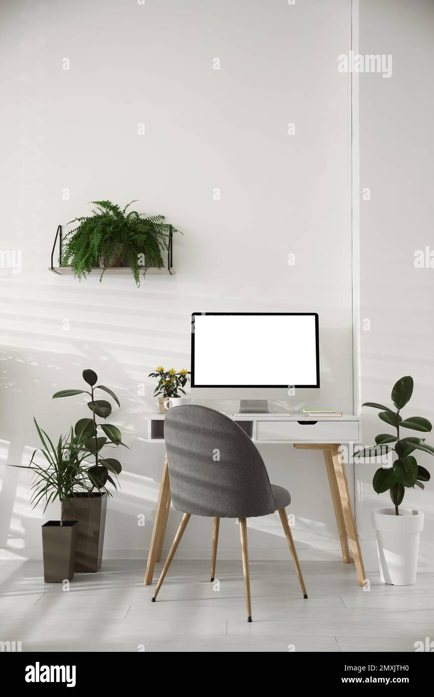 Home workplace with modern computer and desk in room. Mockup for design ...