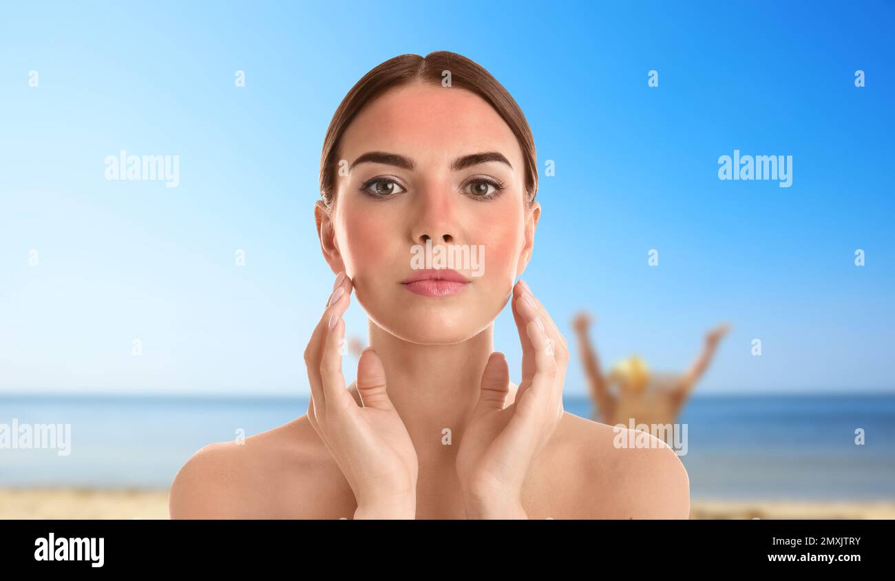 Woman With Sunburn On Beach Skin Protection From Sun In Summer Stock