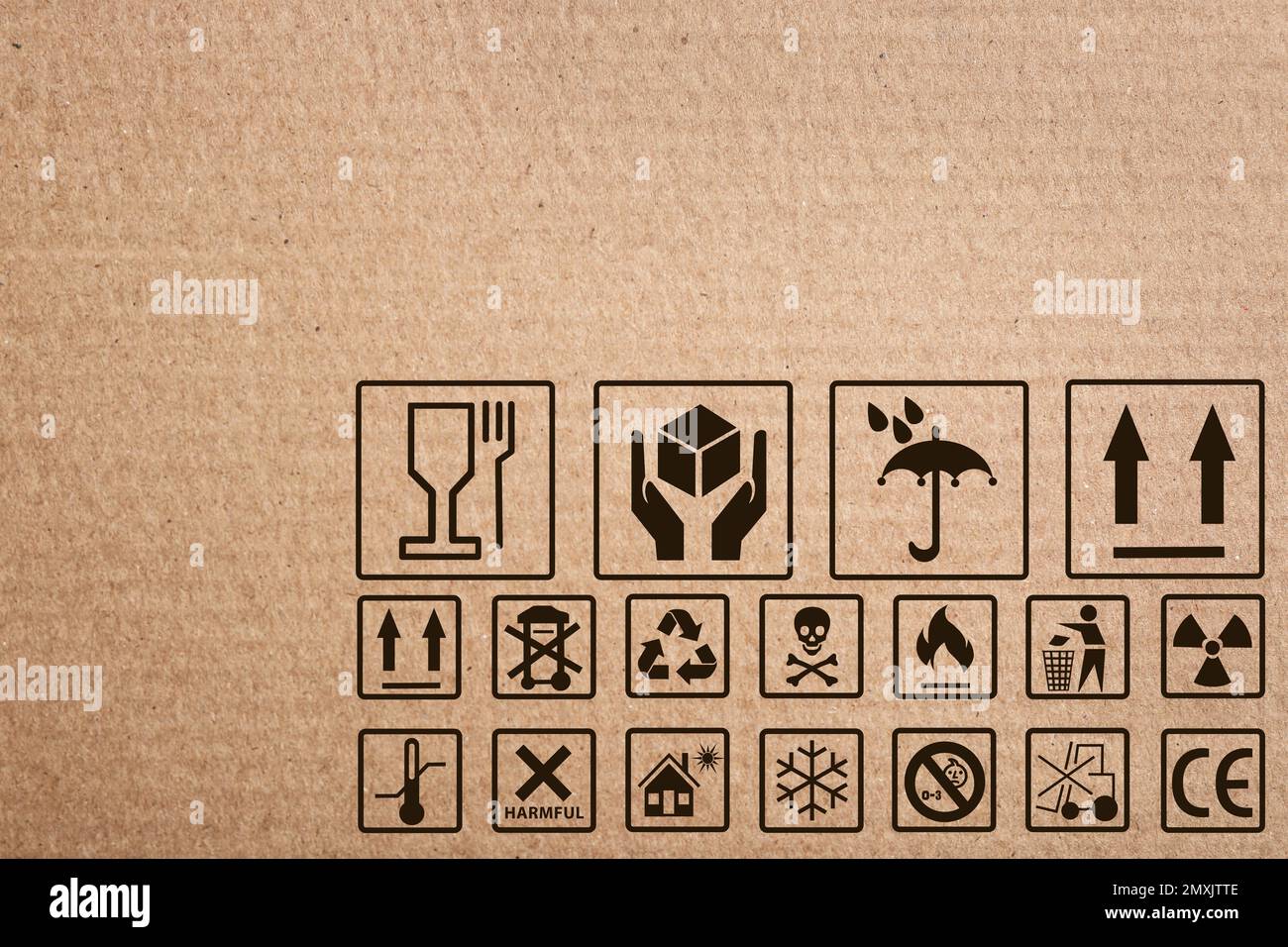 Cardboard box with packaging symbols as background, closeup Stock Photo ...