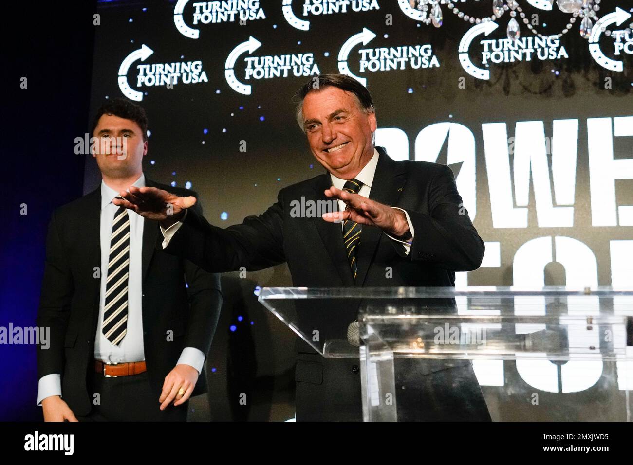 Brazil's right wing former President Jair Bolsonaro, right, speaks ...