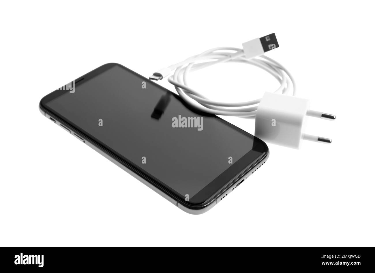 Smartphone and USB charger isolated on white. Modern technology Stock ...