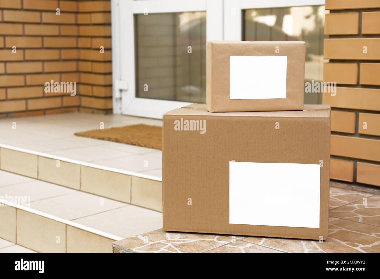 Shipping boxes on front porch hi-res stock photography and images - Alamy