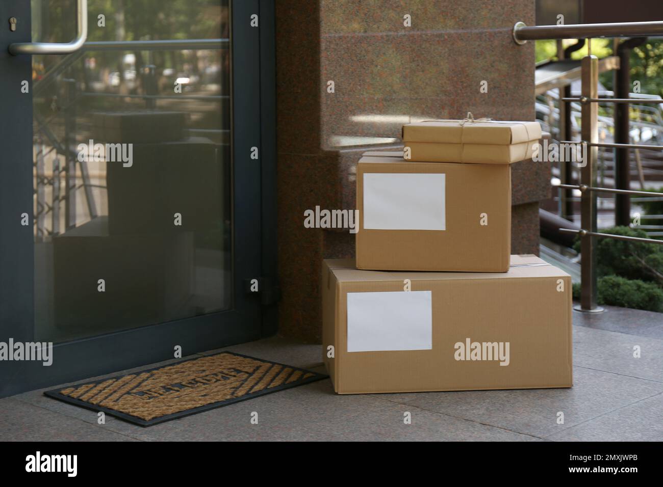 Shipping boxes on front porch hi-res stock photography and images - Alamy