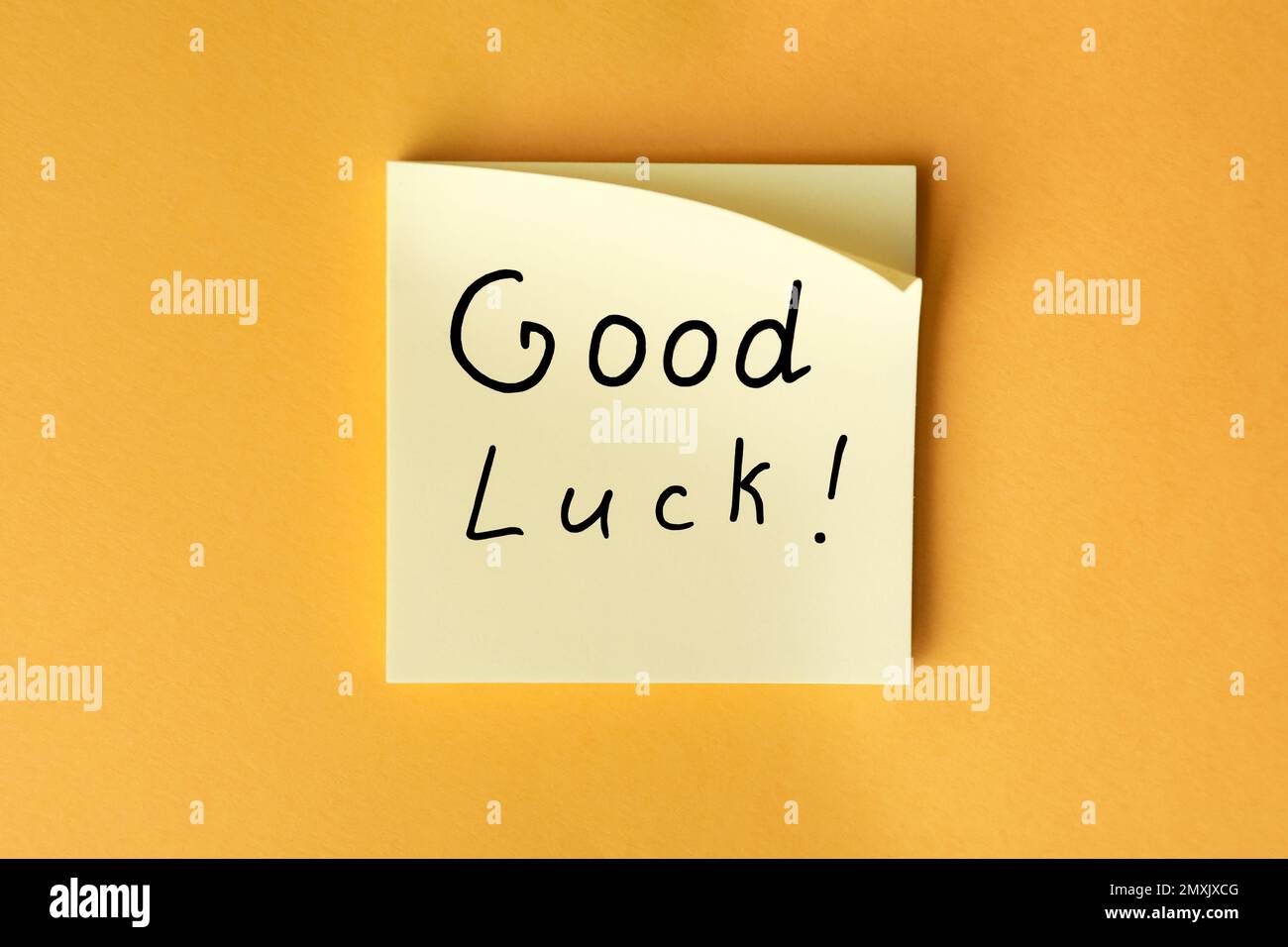 Note with phrase GOOD LUCK on orange background, top view Stock Photo ...