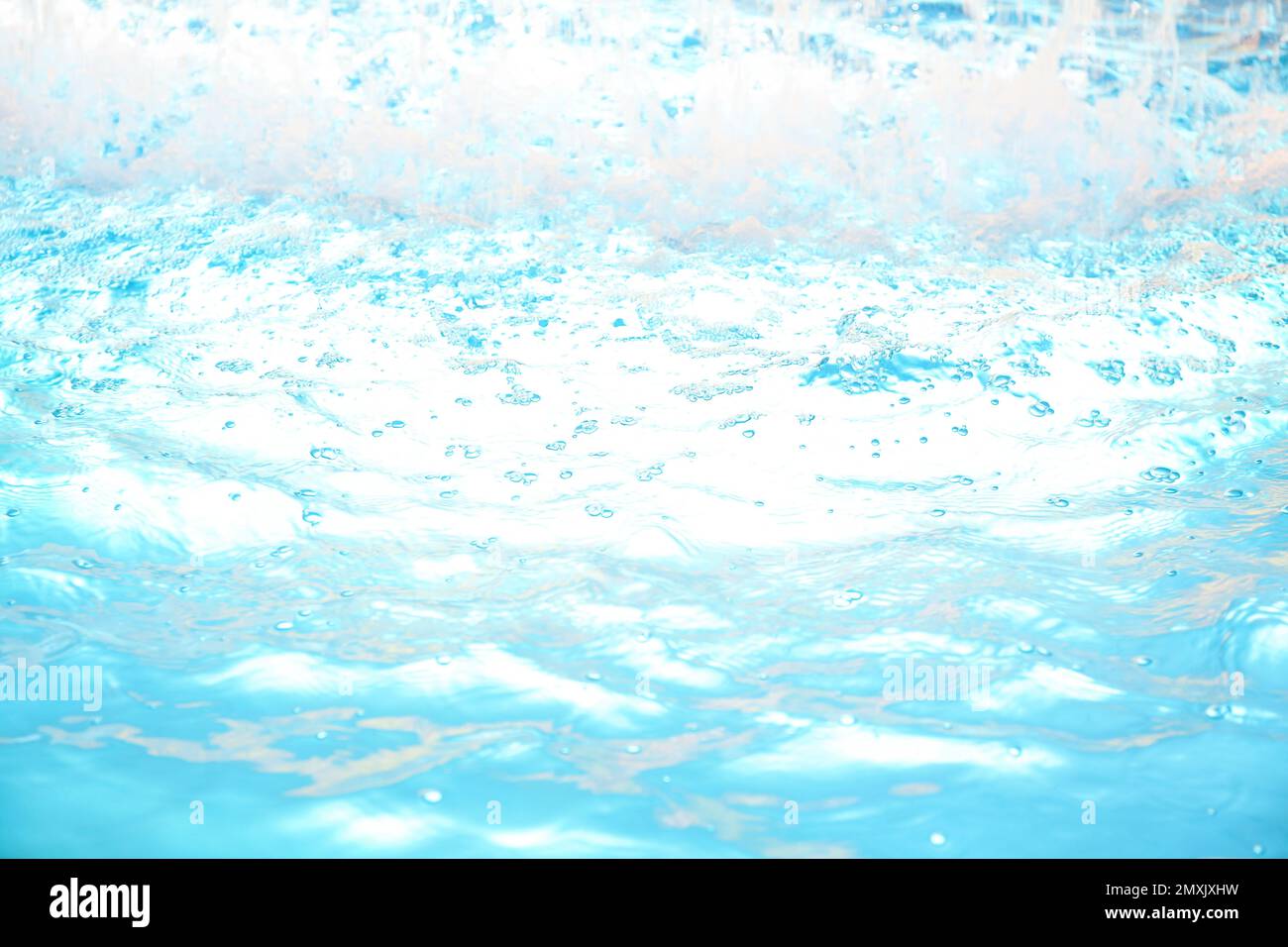 View of water splashing in swimming pool Stock Photo - Alamy