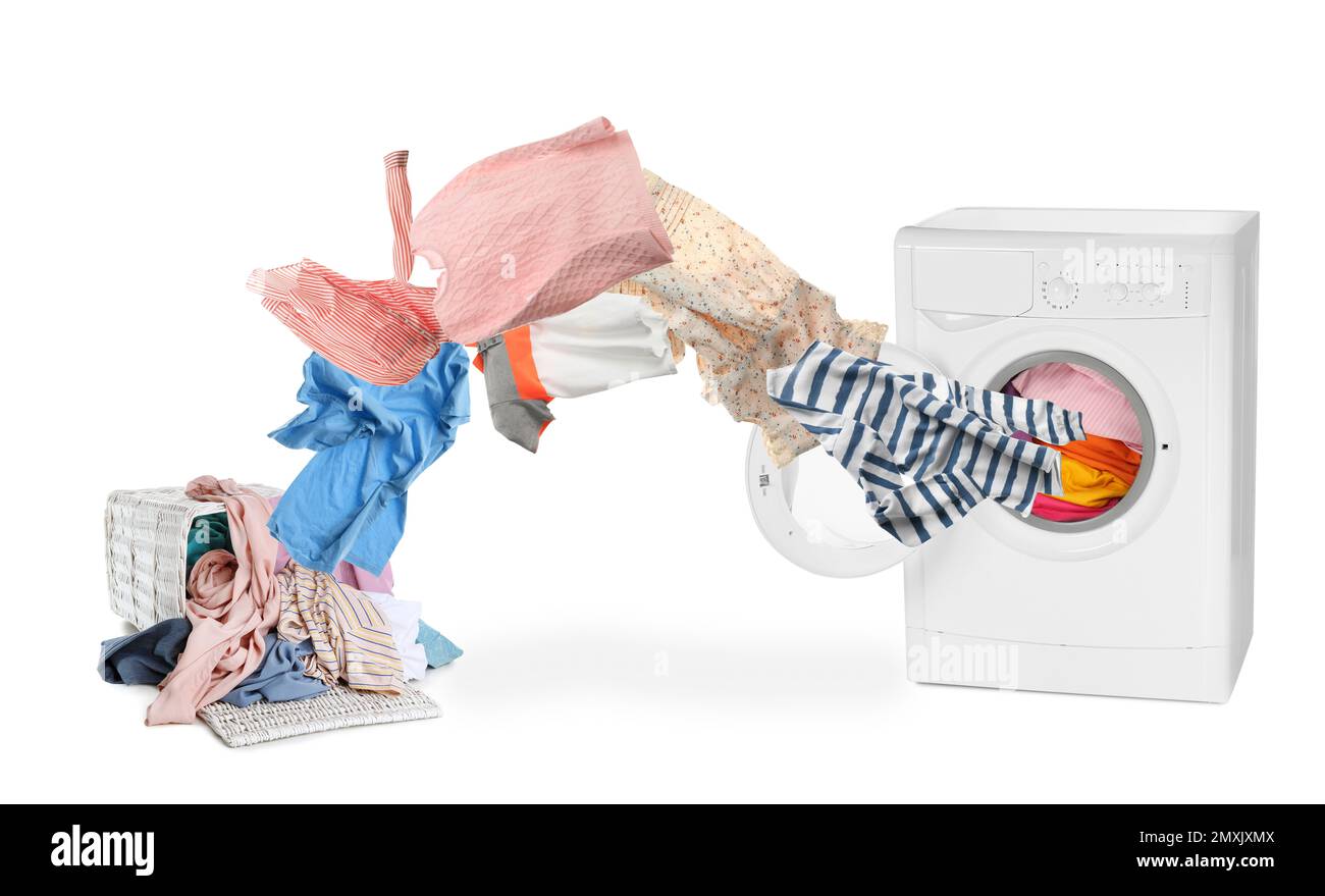 Washing machine and flying clothes on white background Stock Photo - Alamy