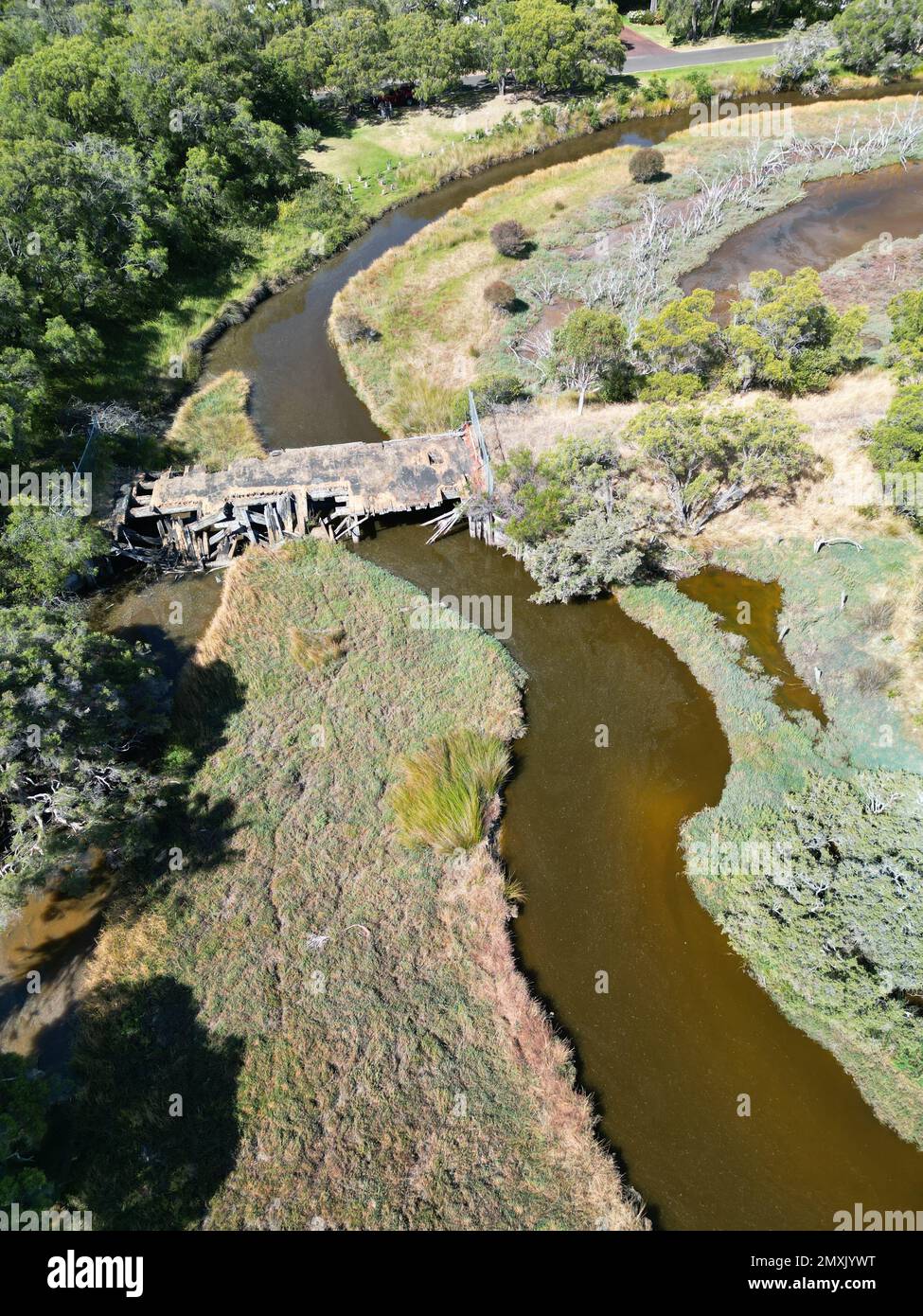 The vertical drone view over a broken bridge and a muddy bridge in the ...