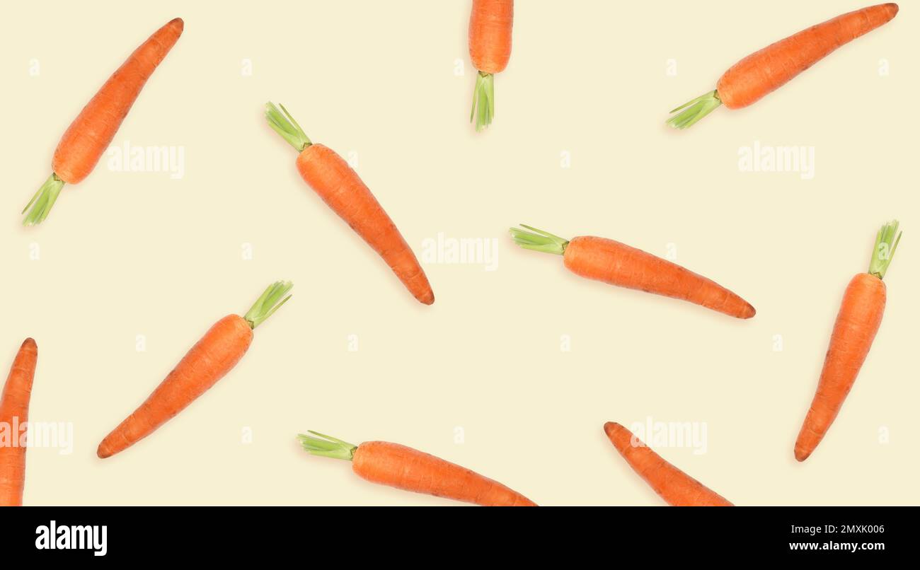 Whole carrots on beige background, banner. Pattern design Stock Photo ...