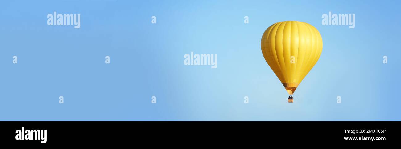 Hot air balloon in blue sky, space for text. Banner design Stock Photo ...