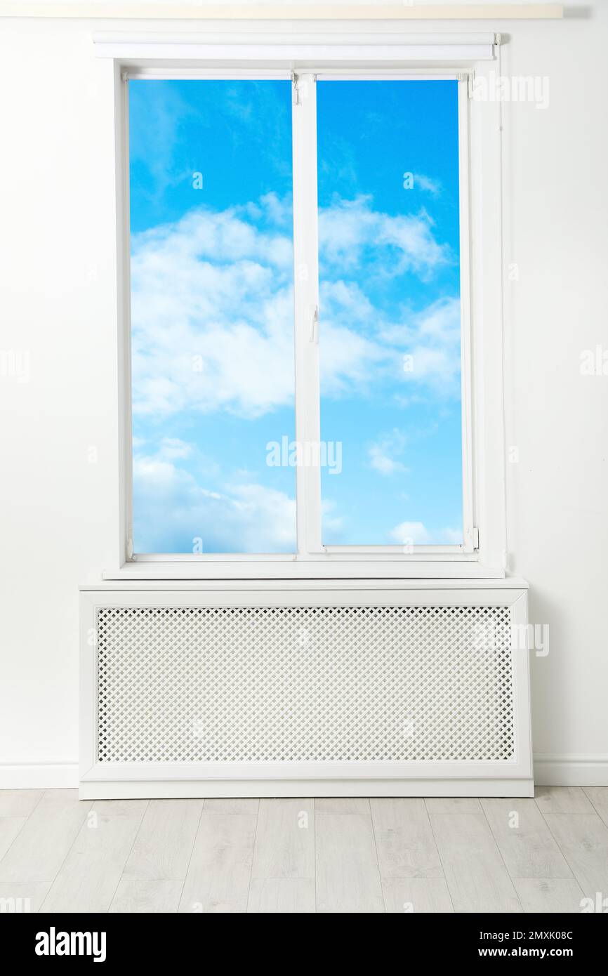 Beautiful view on blue sky with clouds through window in room Stock ...