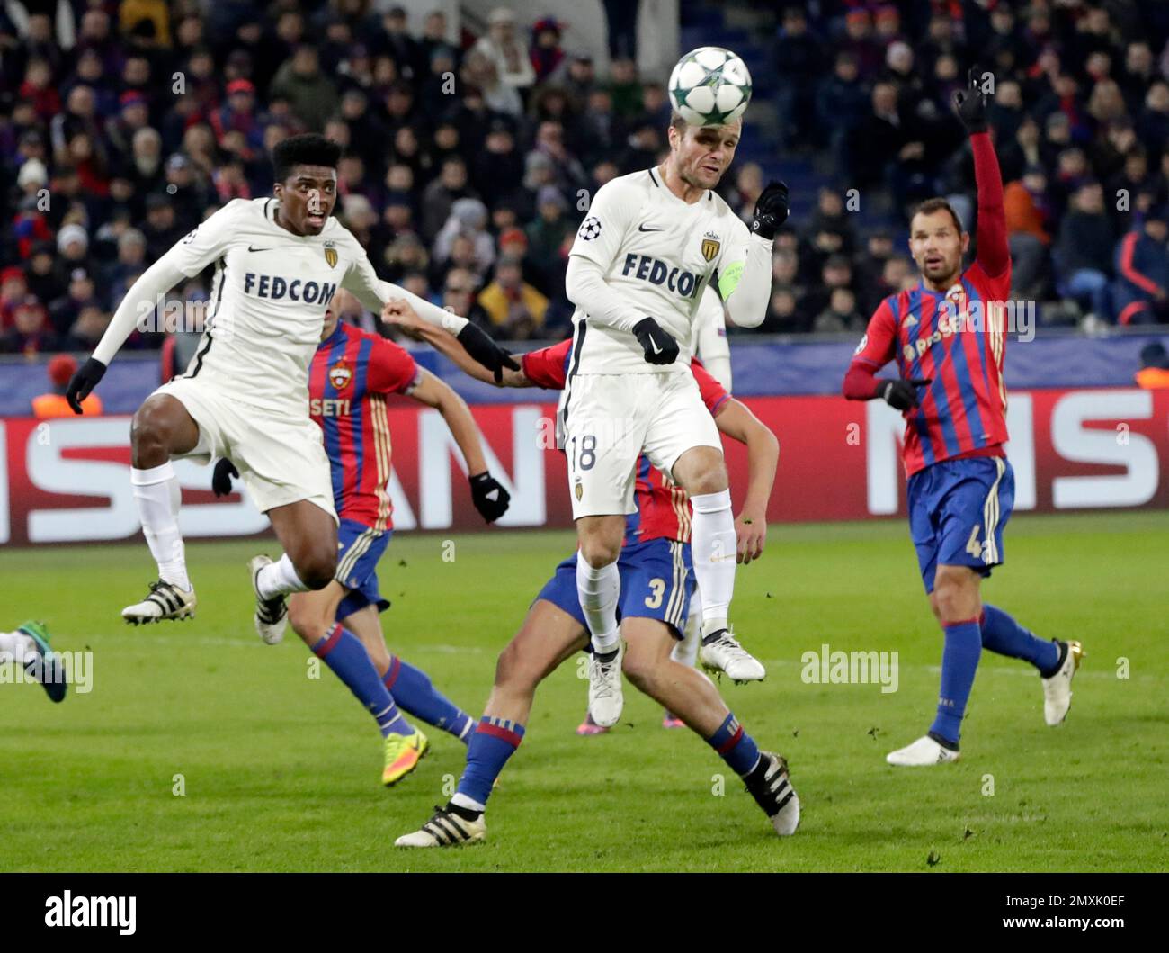 Monaco's Jemerson, left, and Monaco's Valere Germain, center, jump for ...